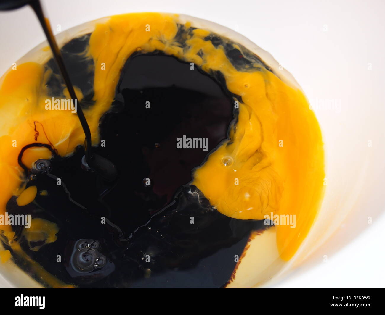 Adding Molasses into Egg Mixture. Making Treacle Pie Series Stock Photo ...