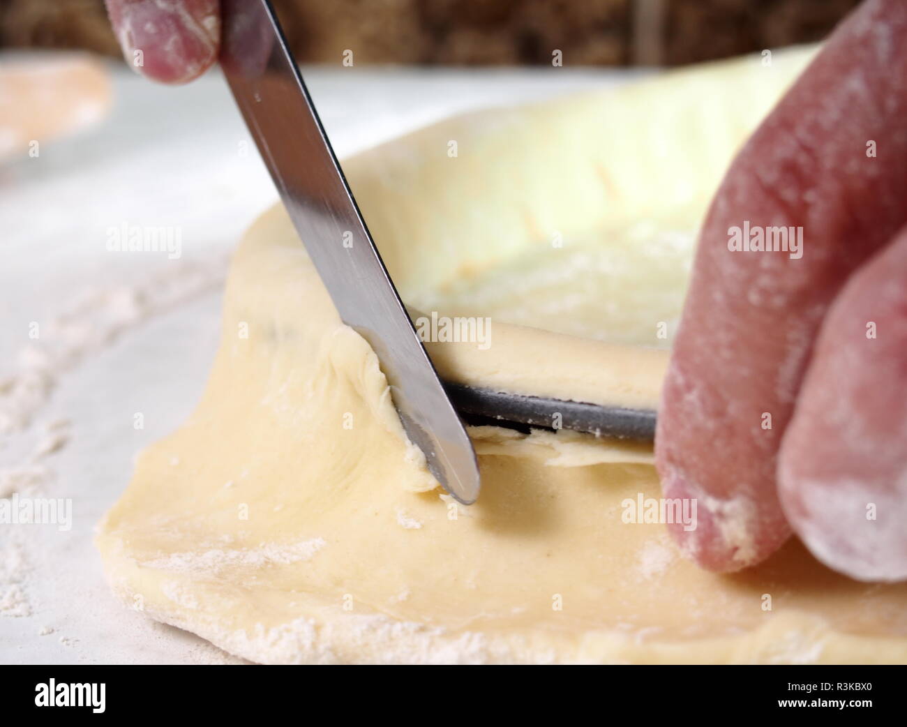 Trimming dough edges with knife. Making Treacle Pie Series Stock Photo ...