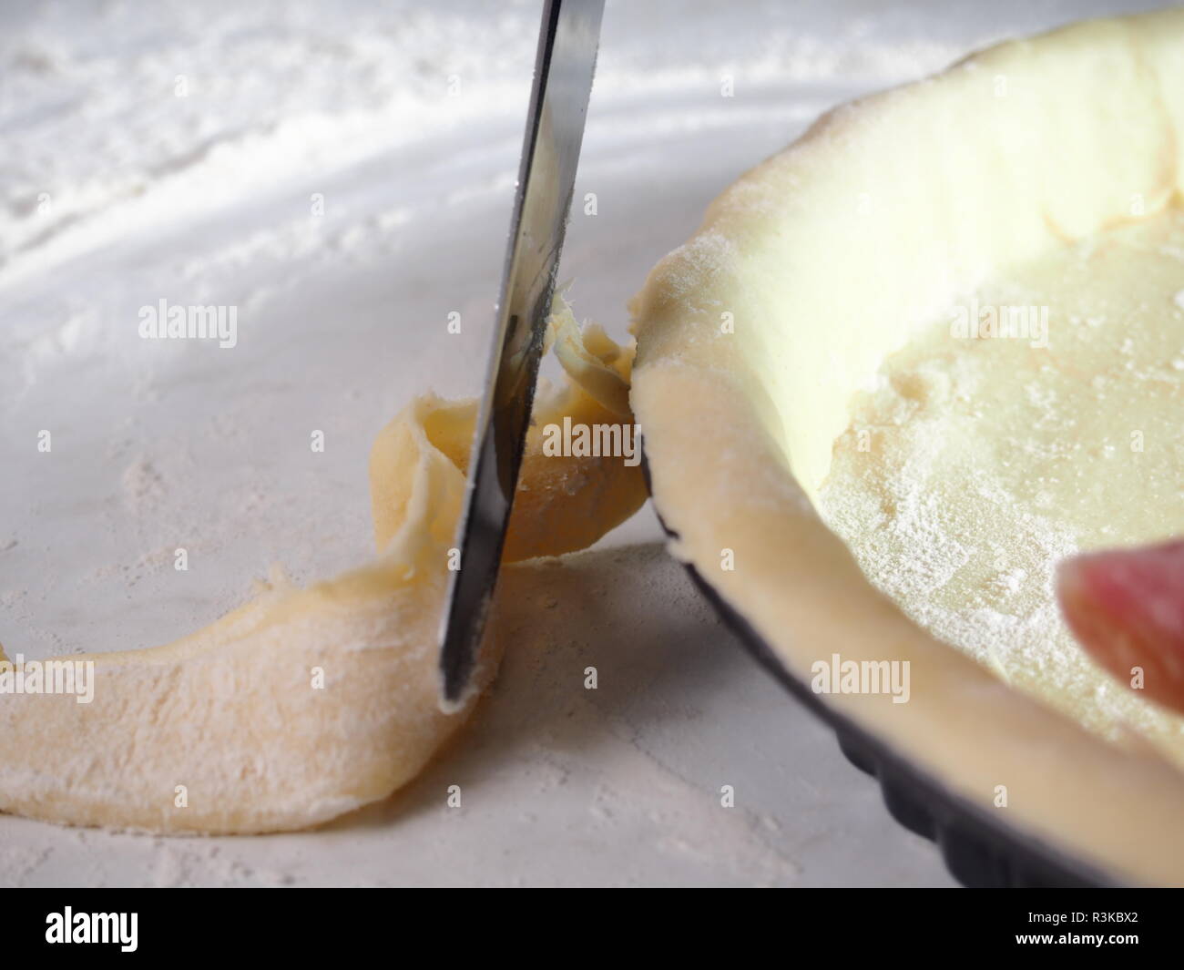 Trimming dough edges with knife. Making Treacle Pie Series Stock Photo ...