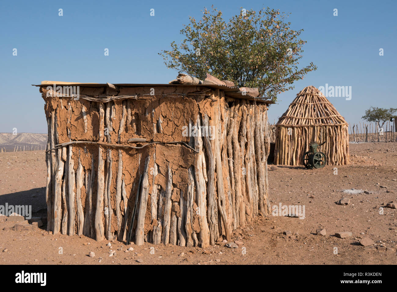 Traditional hut construction in a remote village outside of Opuwo ...