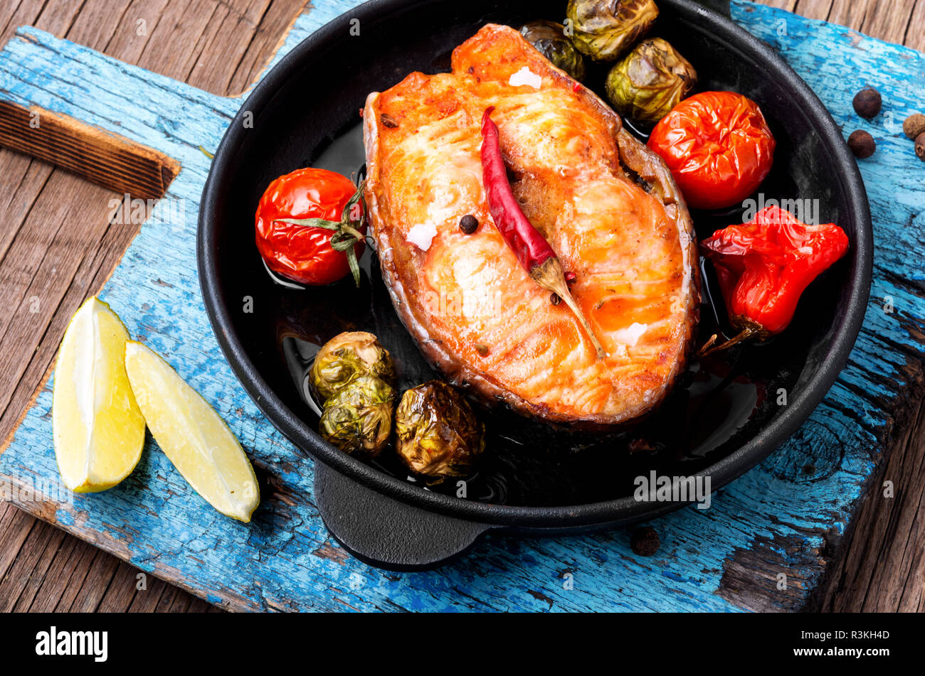 Grilled salmon with vegetables.Fish steak with vegetable garnish.Fish ...