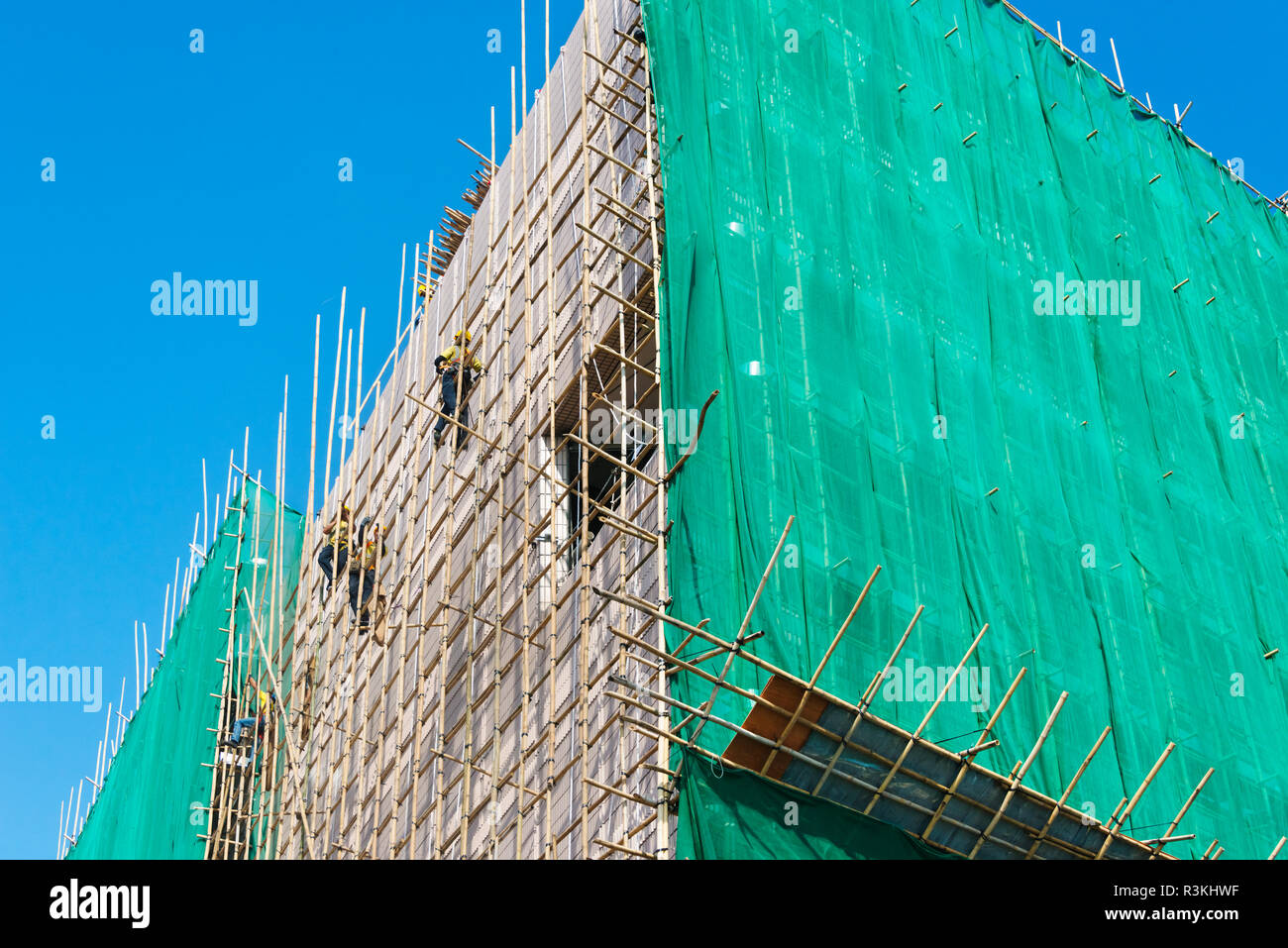 Scaffolding wrapping a building, Hong Kong, China Stock Photo - Alamy