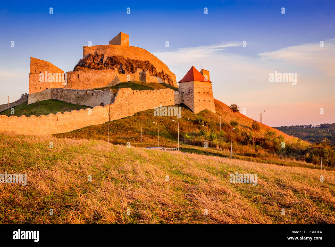 Rupea, Romania. Amazing sunset colors of Rupea fortress ruins in Brasov ...