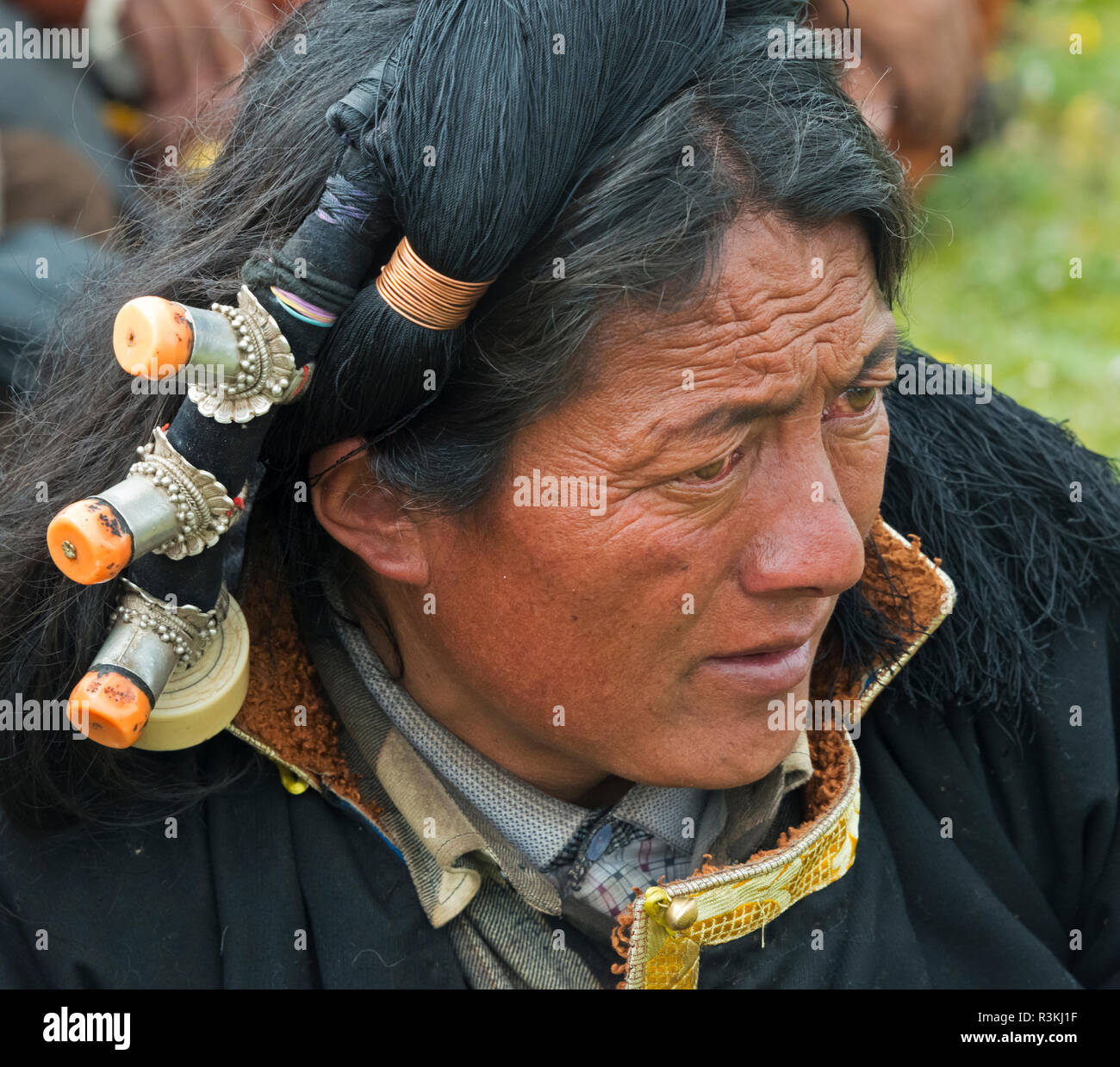 Tibetan man in traditional clothing at Horse Race Festival, Litang ...