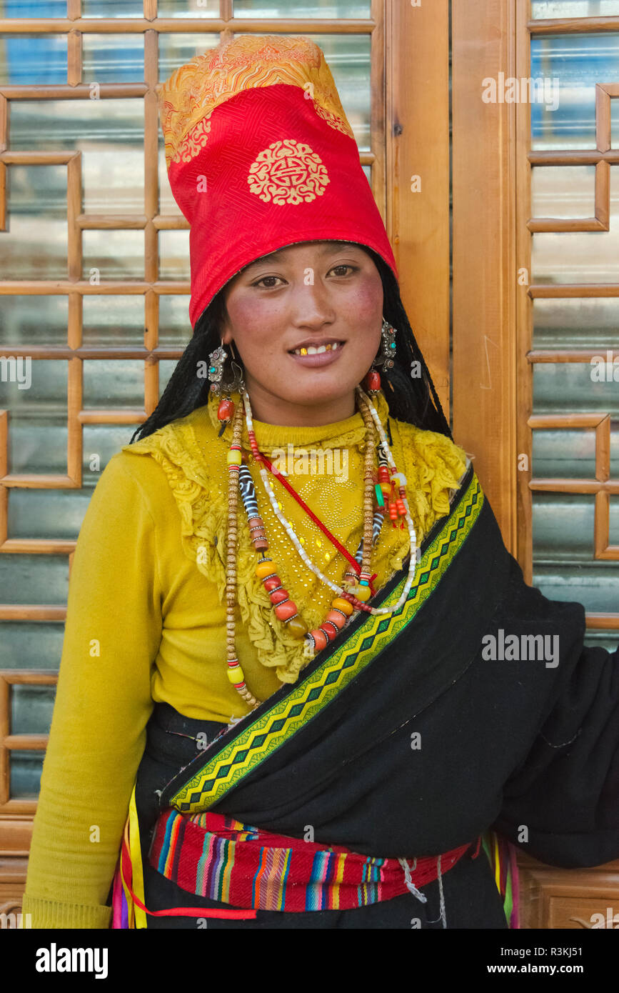 Tibetan woman in traditional clothing, Litang, western Sichuan, China ...