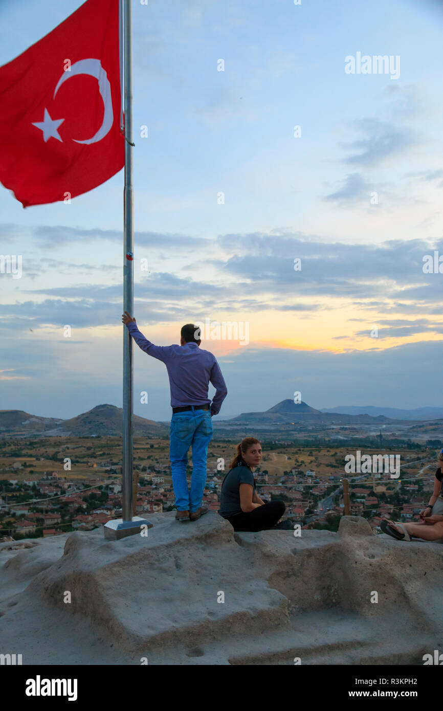Turkey, Anatolia, Cappadocia, Uchisar, Turkish flag flies above the ...