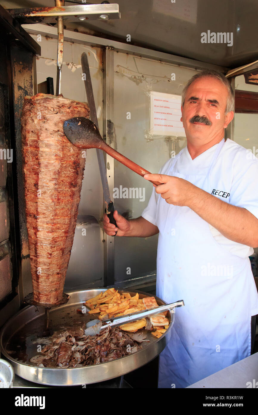 Turkey, Istanbul. Waiter slicing meat for a Doner Kabab. (Editorial Use ...