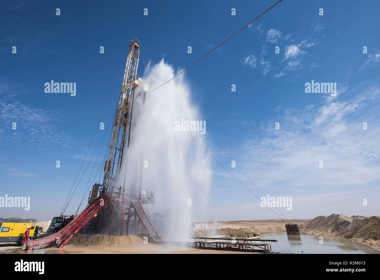 Minya. 20th Nov, 2018. Water bursts out from the well dug by China's ...