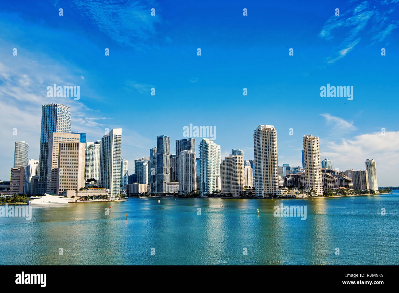 Miami skyscrapers with blue cloudy sky,yacht or boat next to Miami ...