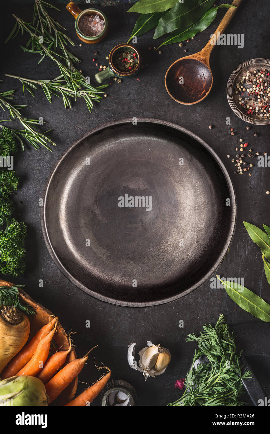 Food cooking and healthy eating background with empty dark rustic plate ...