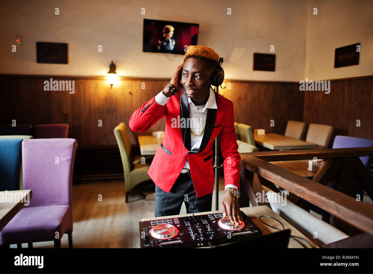 Fashion african american man model DJ at red suit with dj controller ...