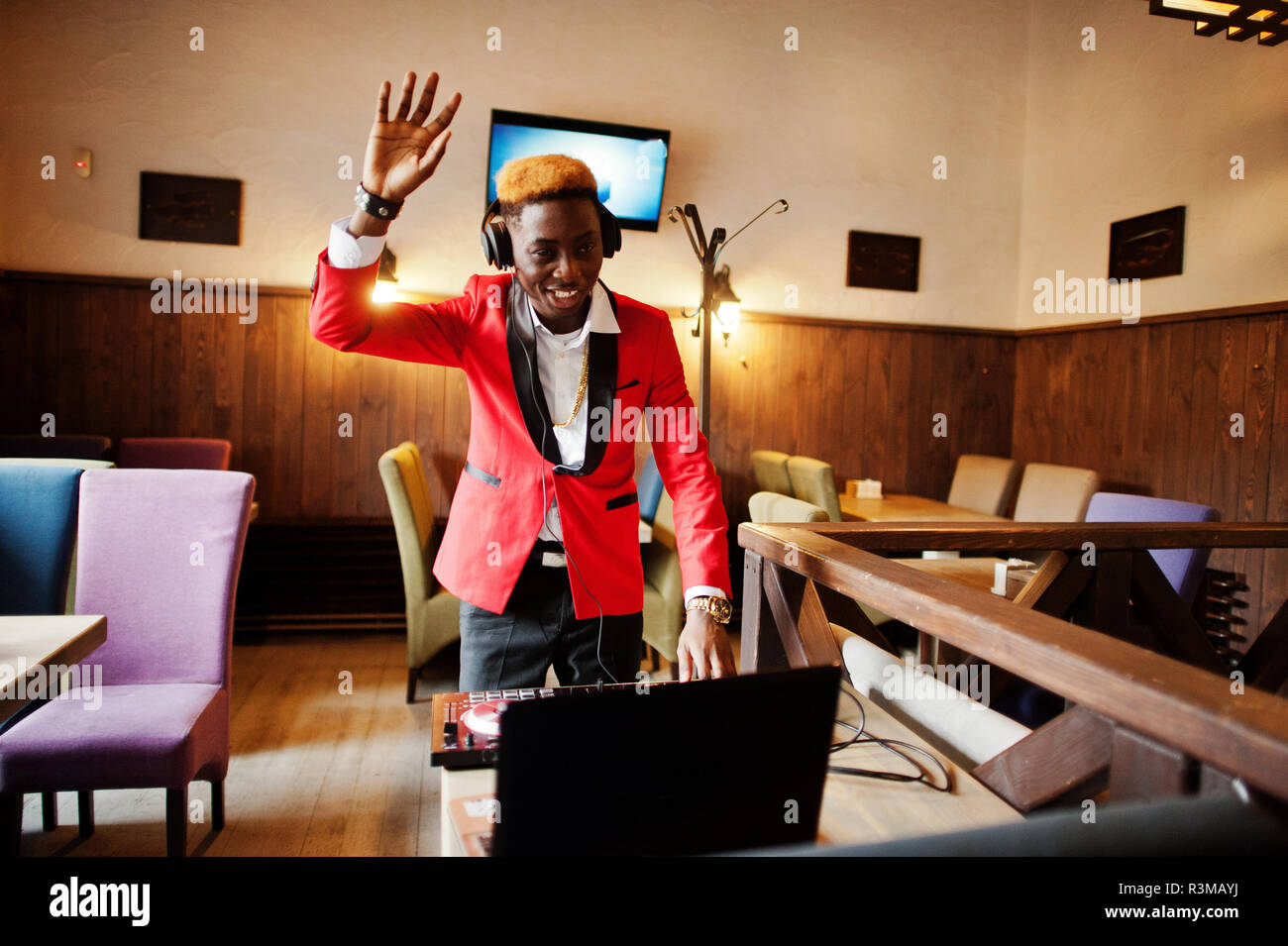 Fashion african american man model DJ at red suit with dj controller ...