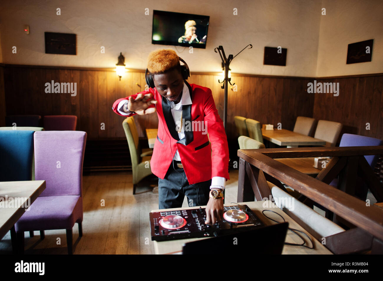 Fashion african american man model DJ at red suit with dj controller ...