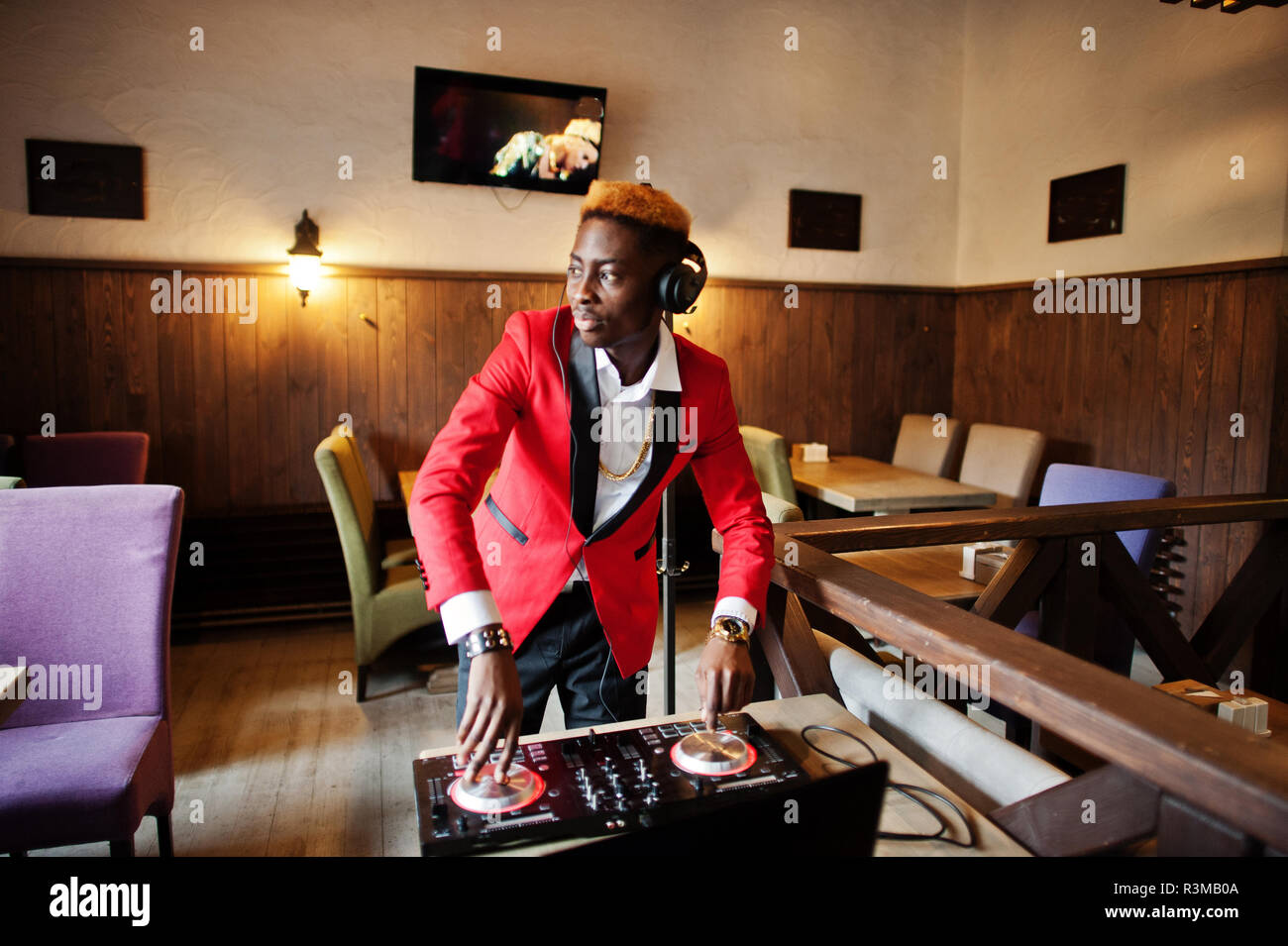 Fashion african american man model DJ at red suit with dj controller ...