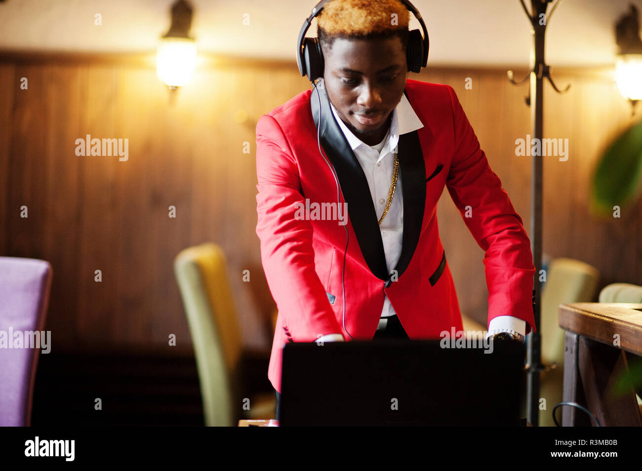Fashion african american man model DJ at red suit with dj controller ...