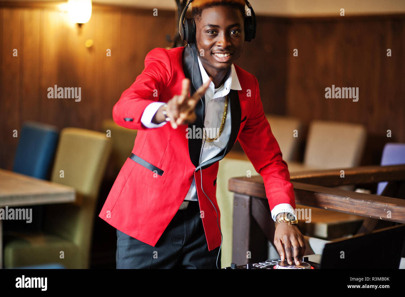 Fashion african american man model DJ at red suit with dj controller ...