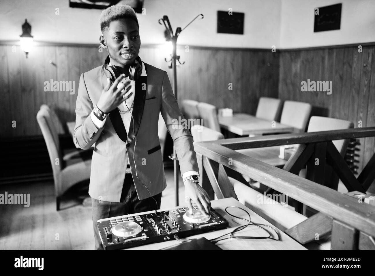 Fashion african american man model DJ at red suit with dj controller ...