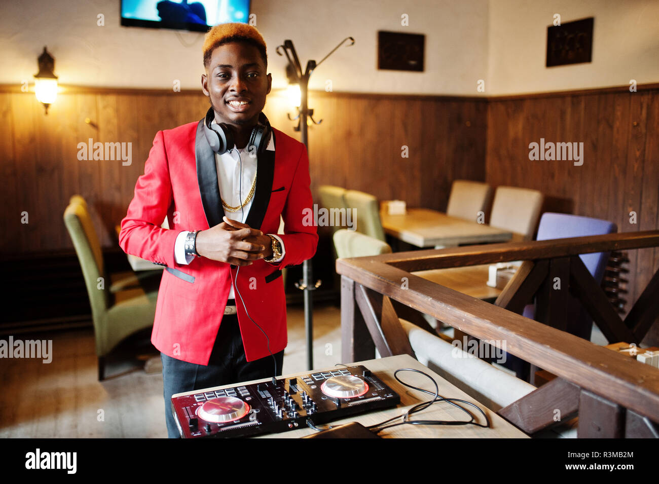 Fashion african american man model DJ at red suit with dj controller ...