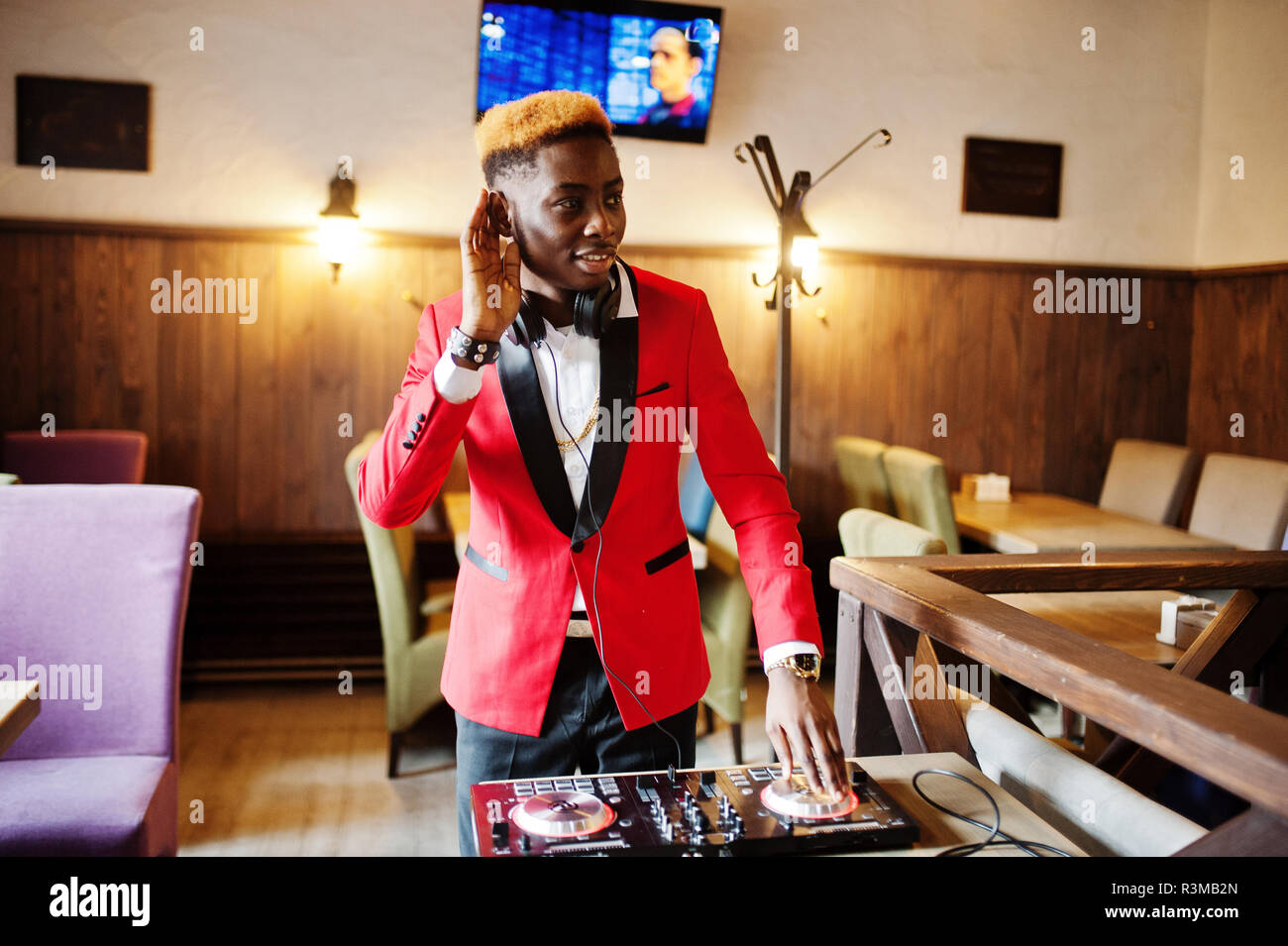 Fashion african american man model DJ at red suit with dj controller ...