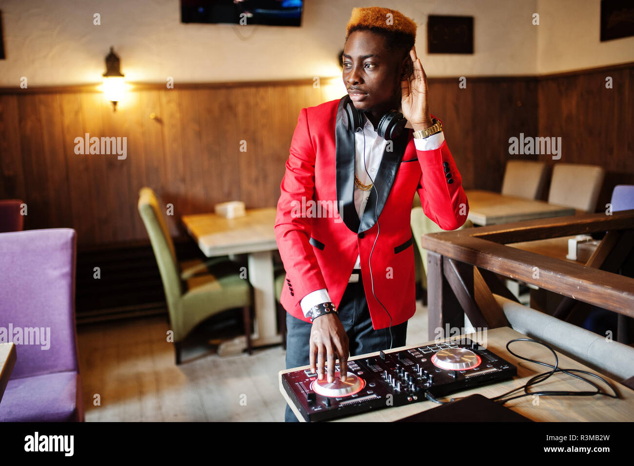 Fashion african american man model DJ at red suit with dj controller ...