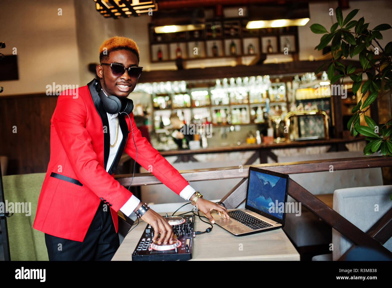 Fashion african american man model DJ at red suit with dj controller ...