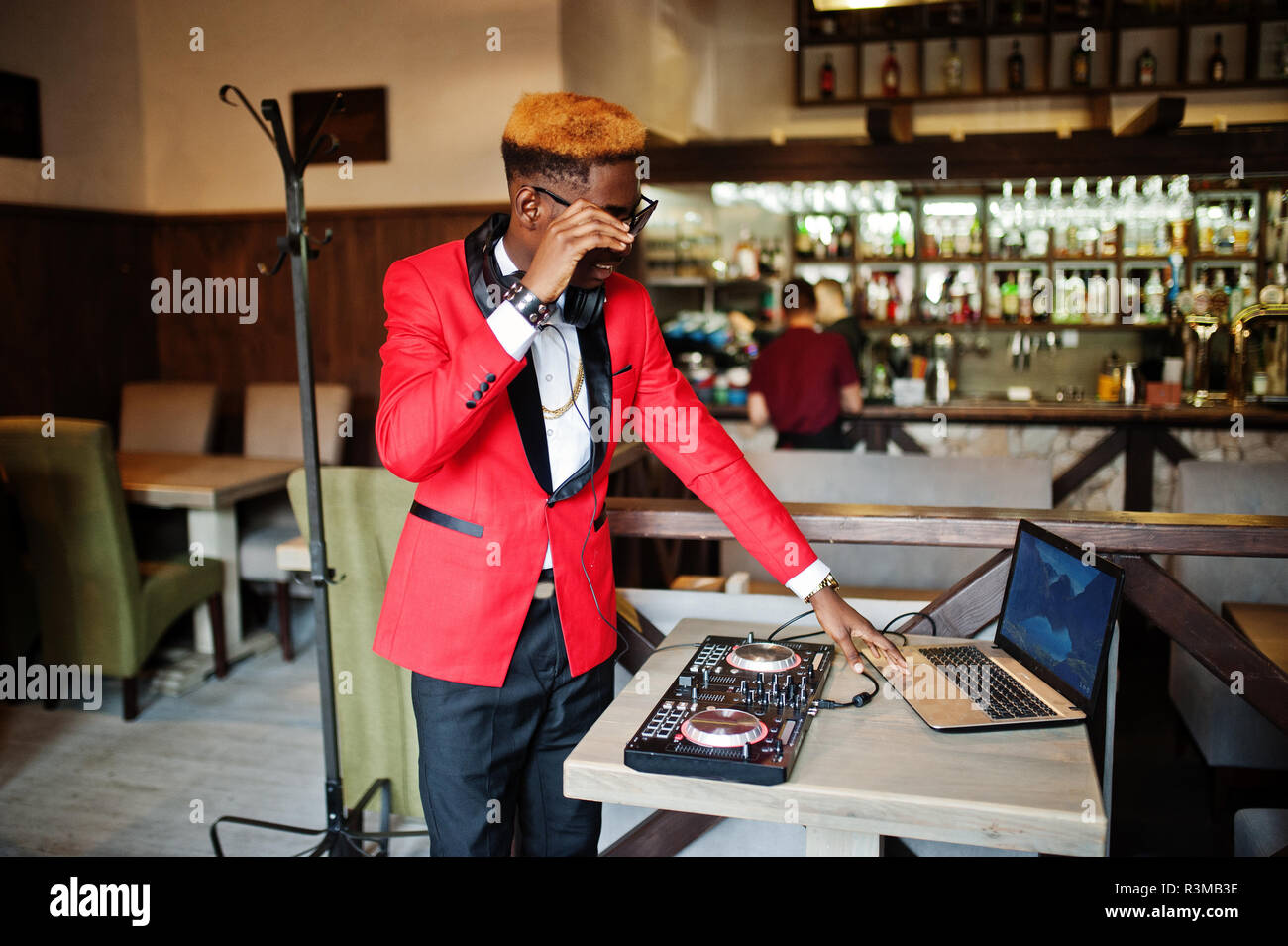 Fashion african american man model DJ at red suit with dj controller ...