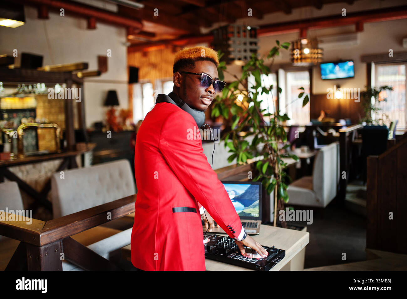 Fashion african american man model DJ at red suit with dj controller ...