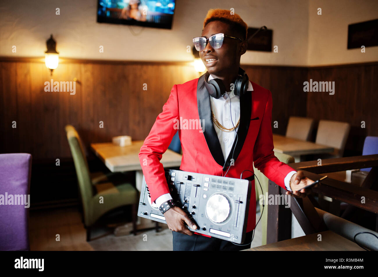 Fashion african american man model DJ at red suit with dj controller ...