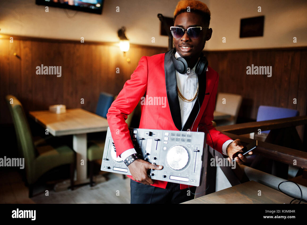 Fashion african american man model DJ at red suit with dj controller ...