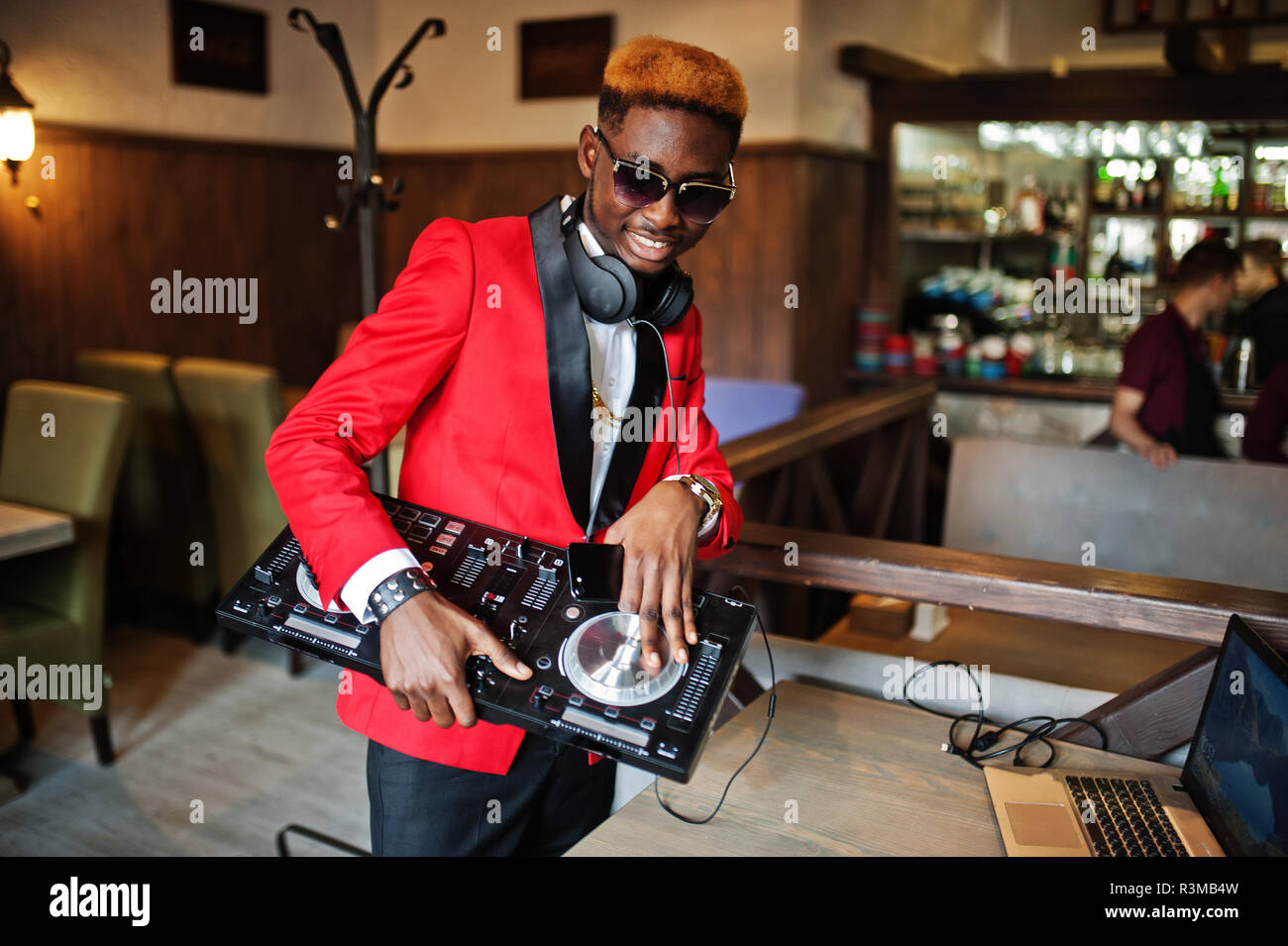 Fashion african american man model DJ at red suit with dj controller ...