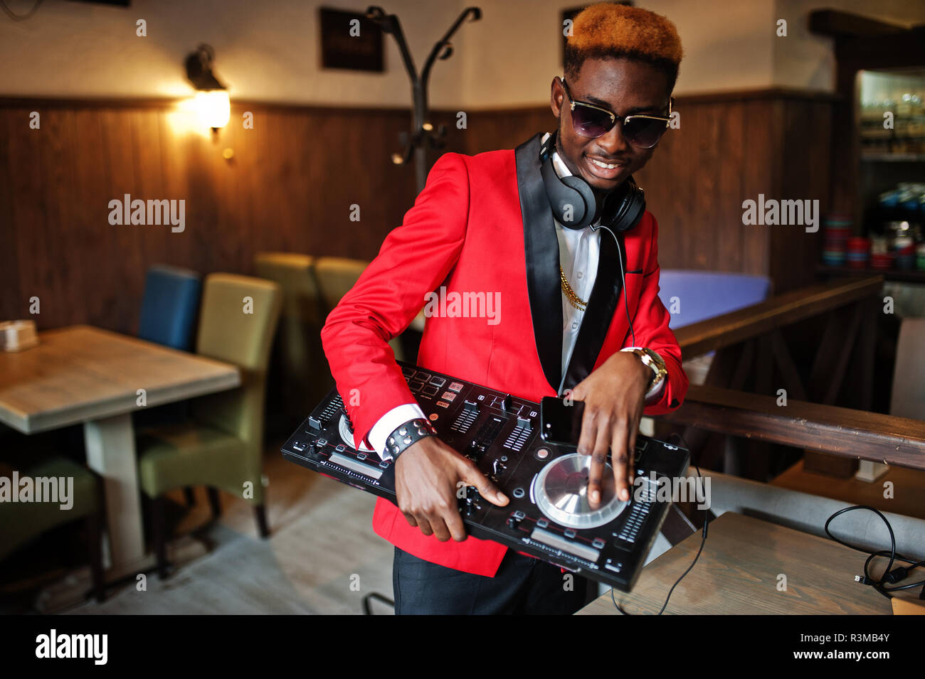 Fashion african american man model DJ at red suit with dj controller ...