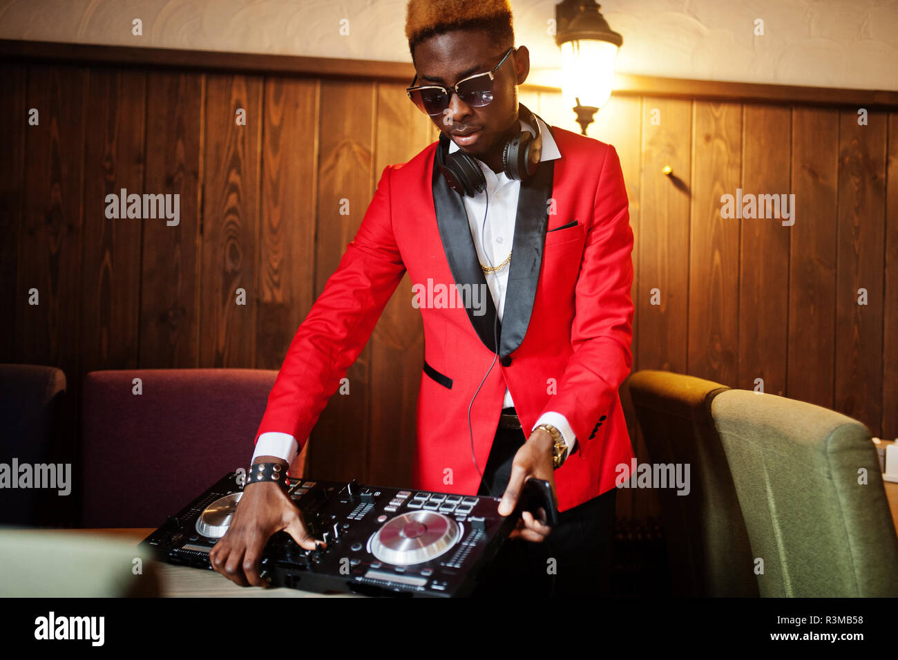 Fashion african american man model DJ at red suit with dj controller ...