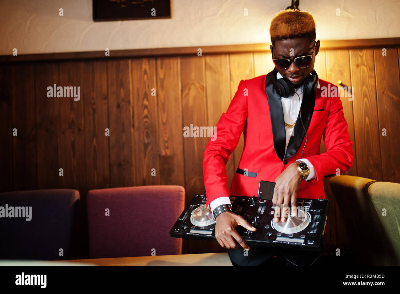 Fashion african american man model DJ at red suit with dj controller ...