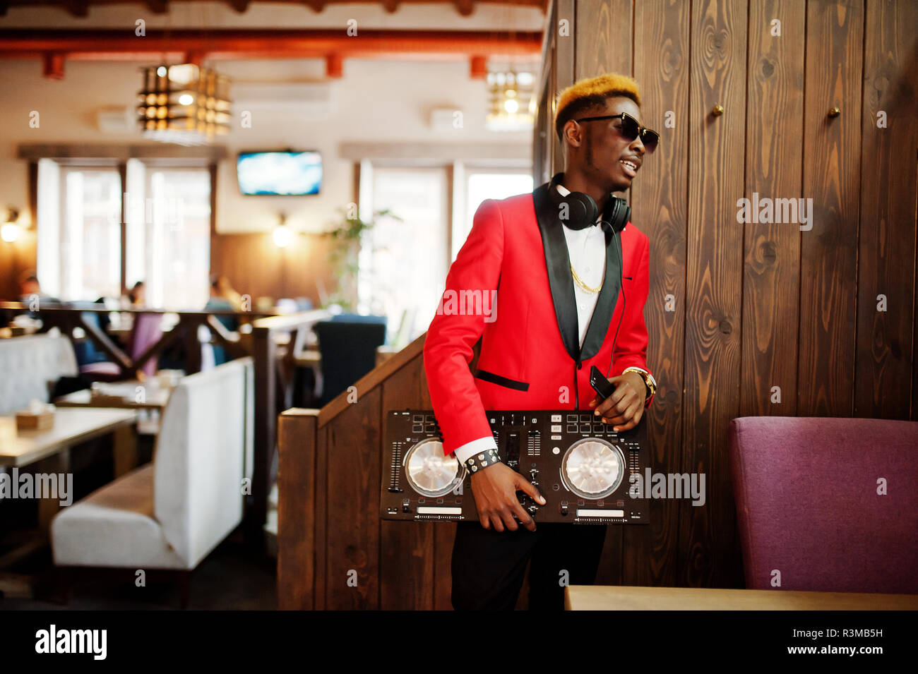 Fashion african american man model DJ at red suit with dj controller ...