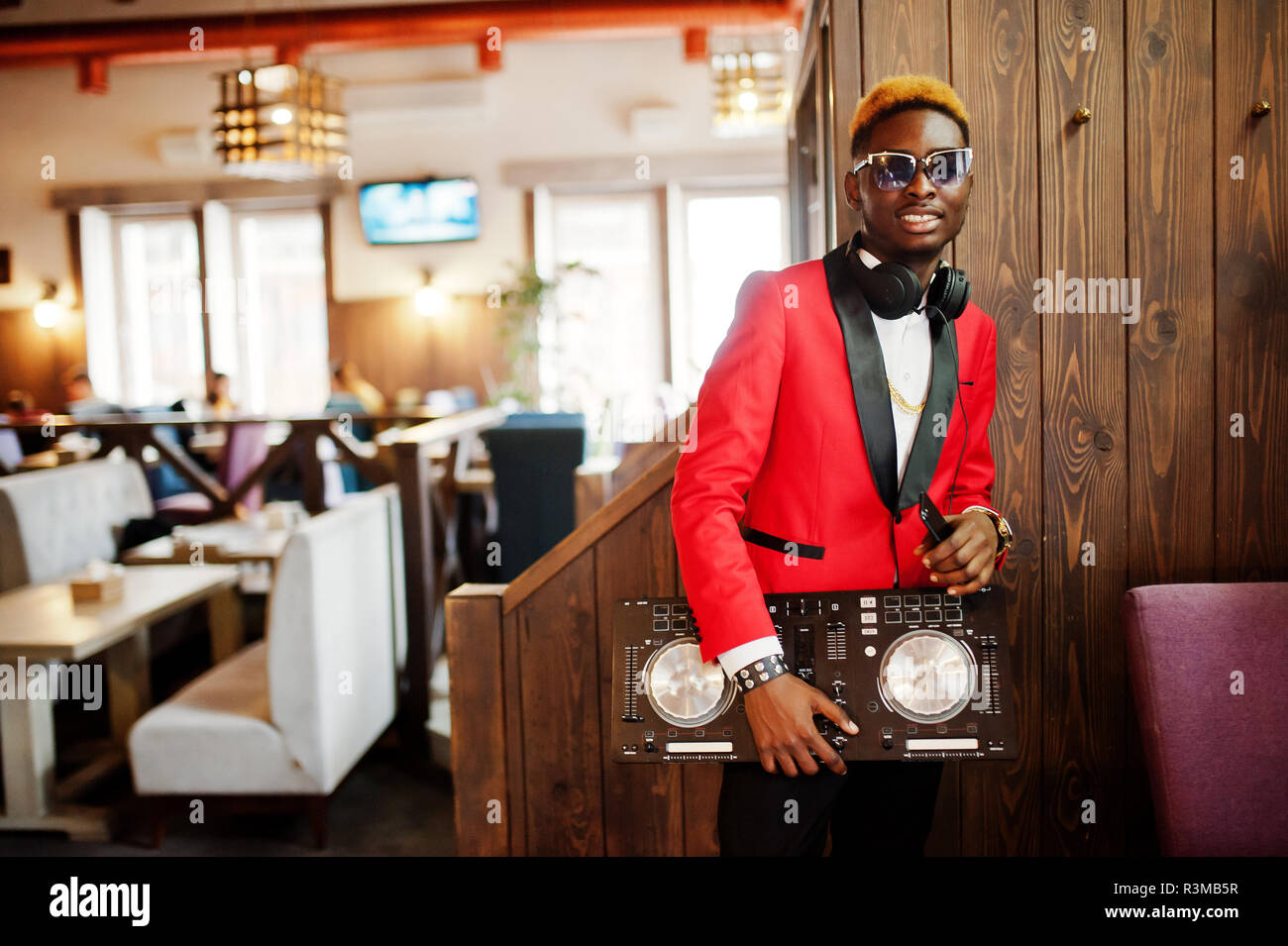 Fashion african american man model DJ at red suit with dj controller ...