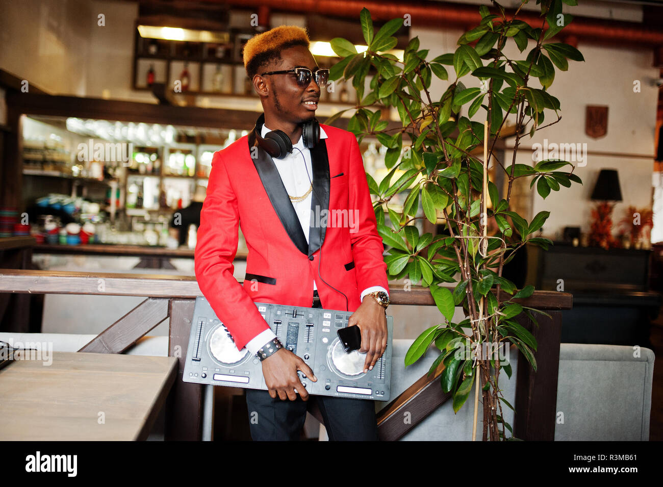 Fashion african american man model DJ at red suit with dj controller ...