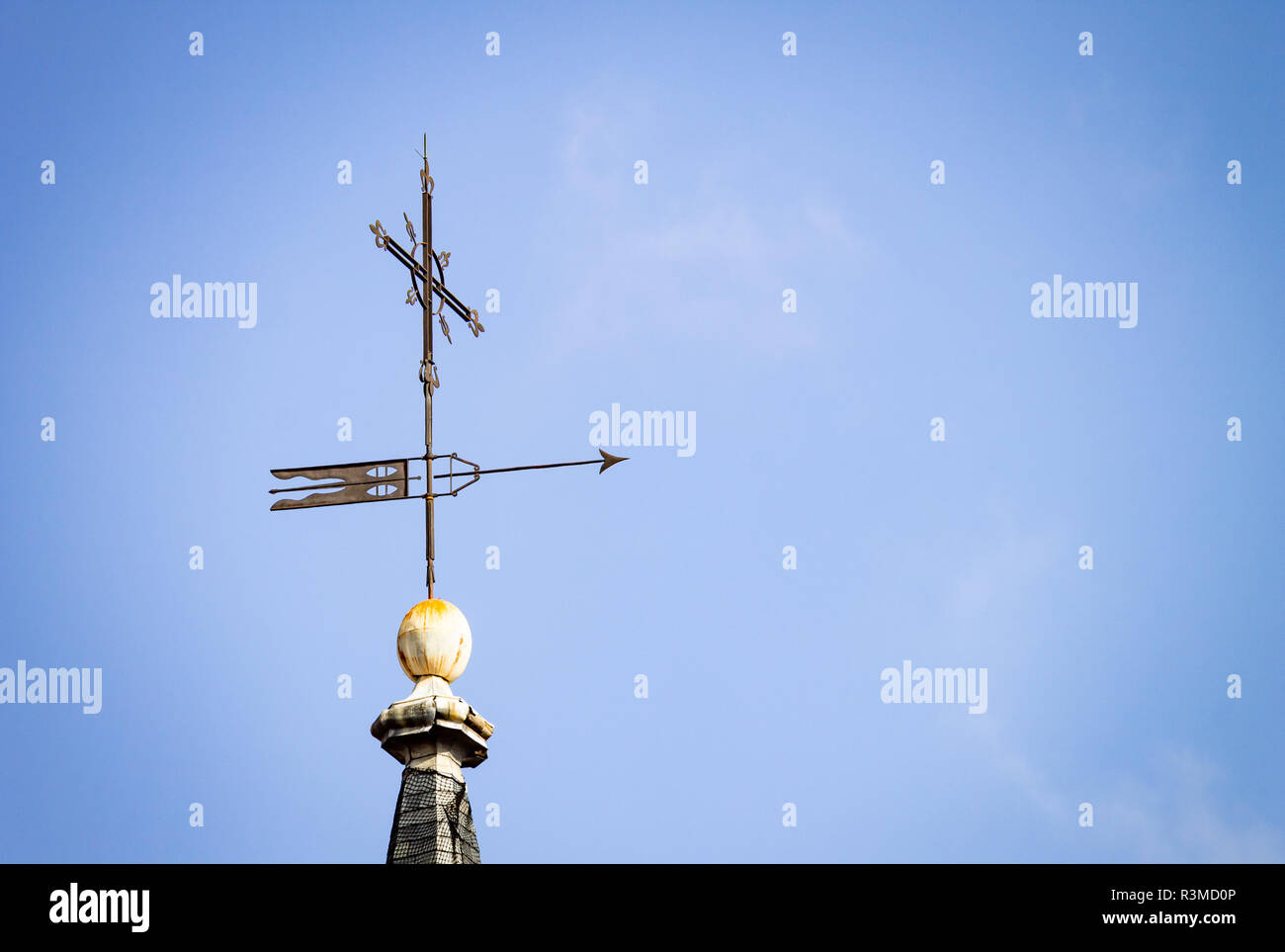 A Wind Compass Rose points to a direction. Blue Sky Background. Copy ...