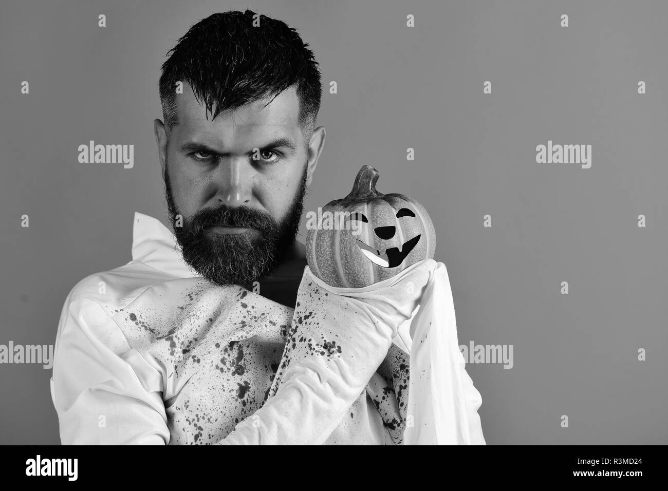 Halloween character in white long sleeved ghost costume. Man with ...