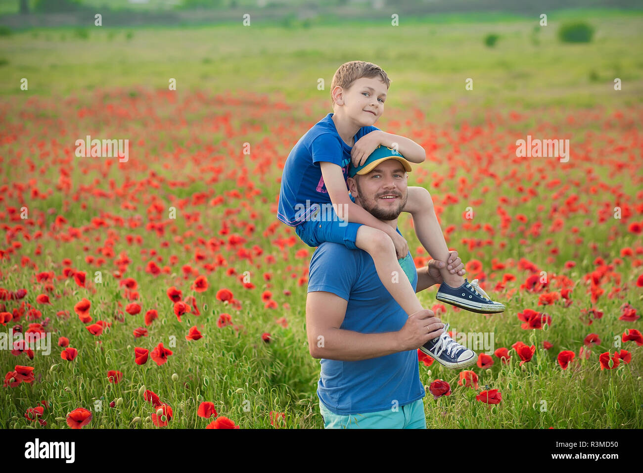 Handsome father together with happy cute smiling boy son and english ...