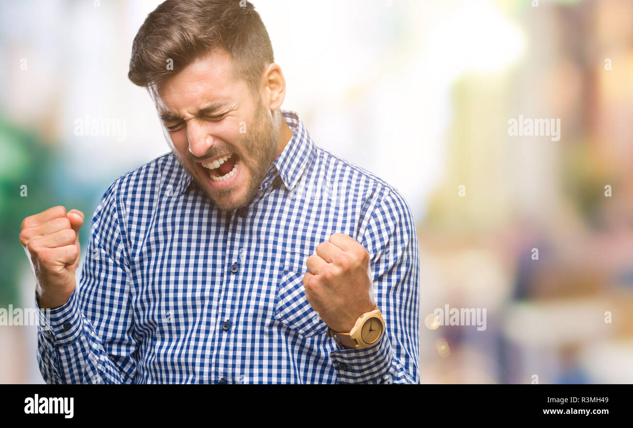 Young handsome man over isolated background very happy and excited ...