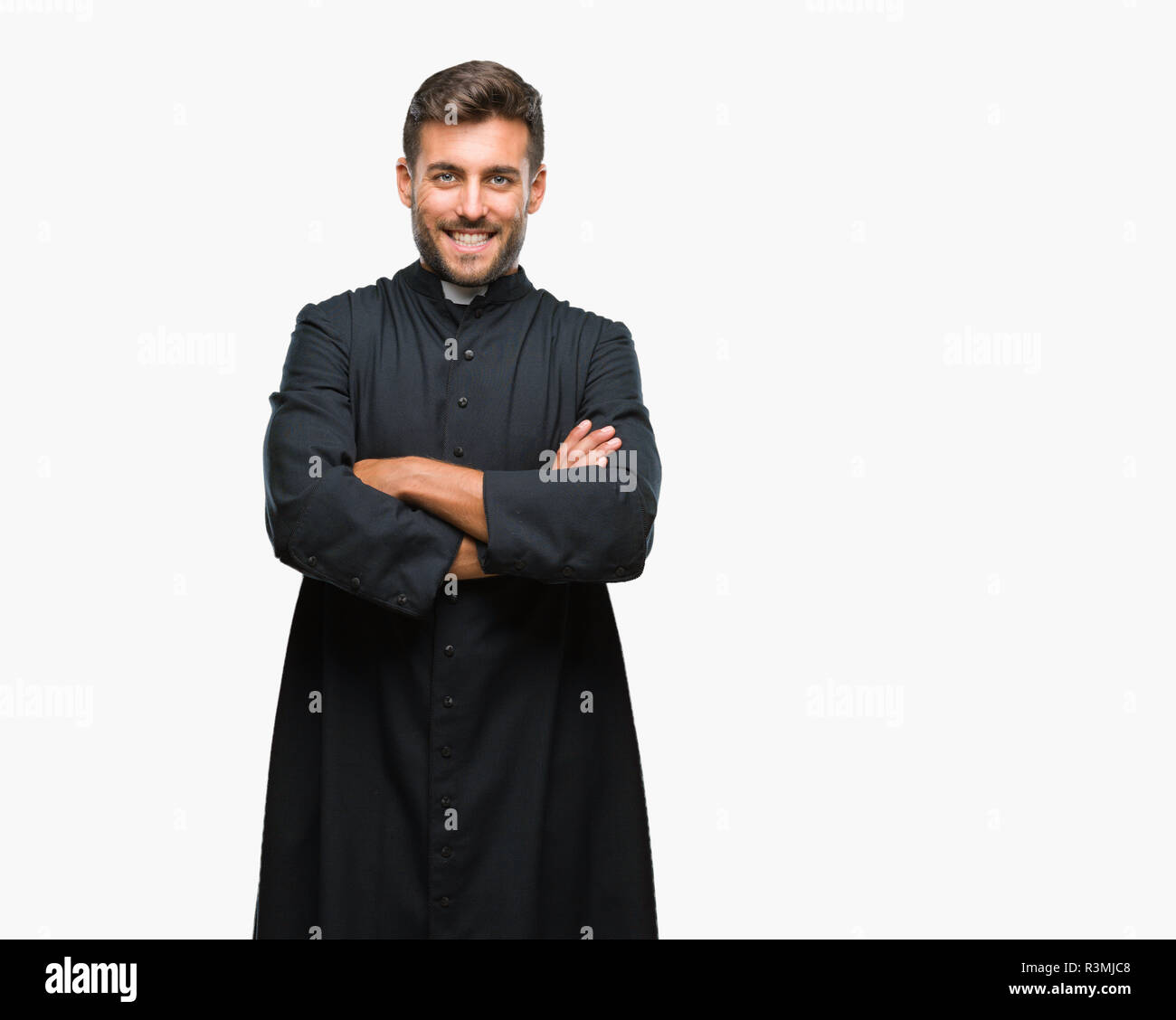 Young catholic christian priest man over isolated background happy face ...