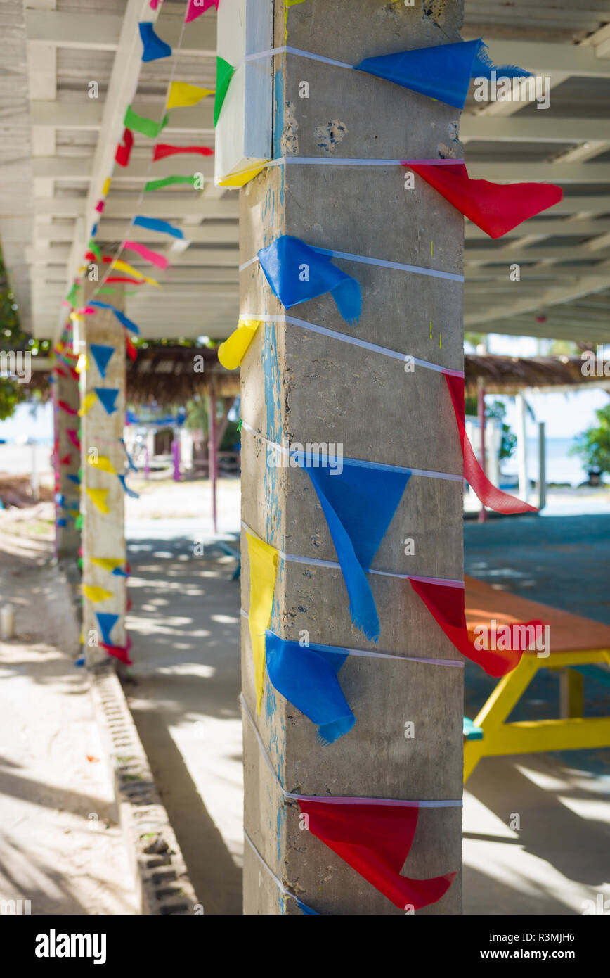 British Virgin Islands, Anegada. Setting Point, beach bar flags Stock ...