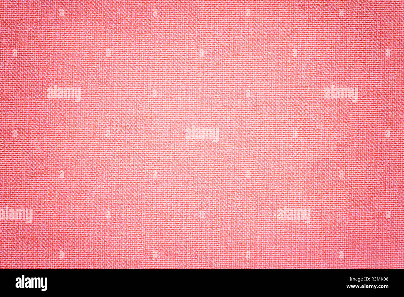 Light pink background from a textile material with wicker pattern ...