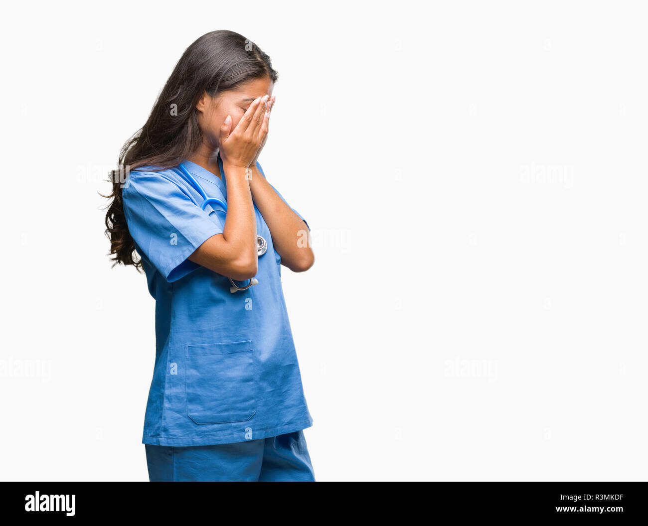 Young arab doctor surgeon woman over isolated background with sad ...