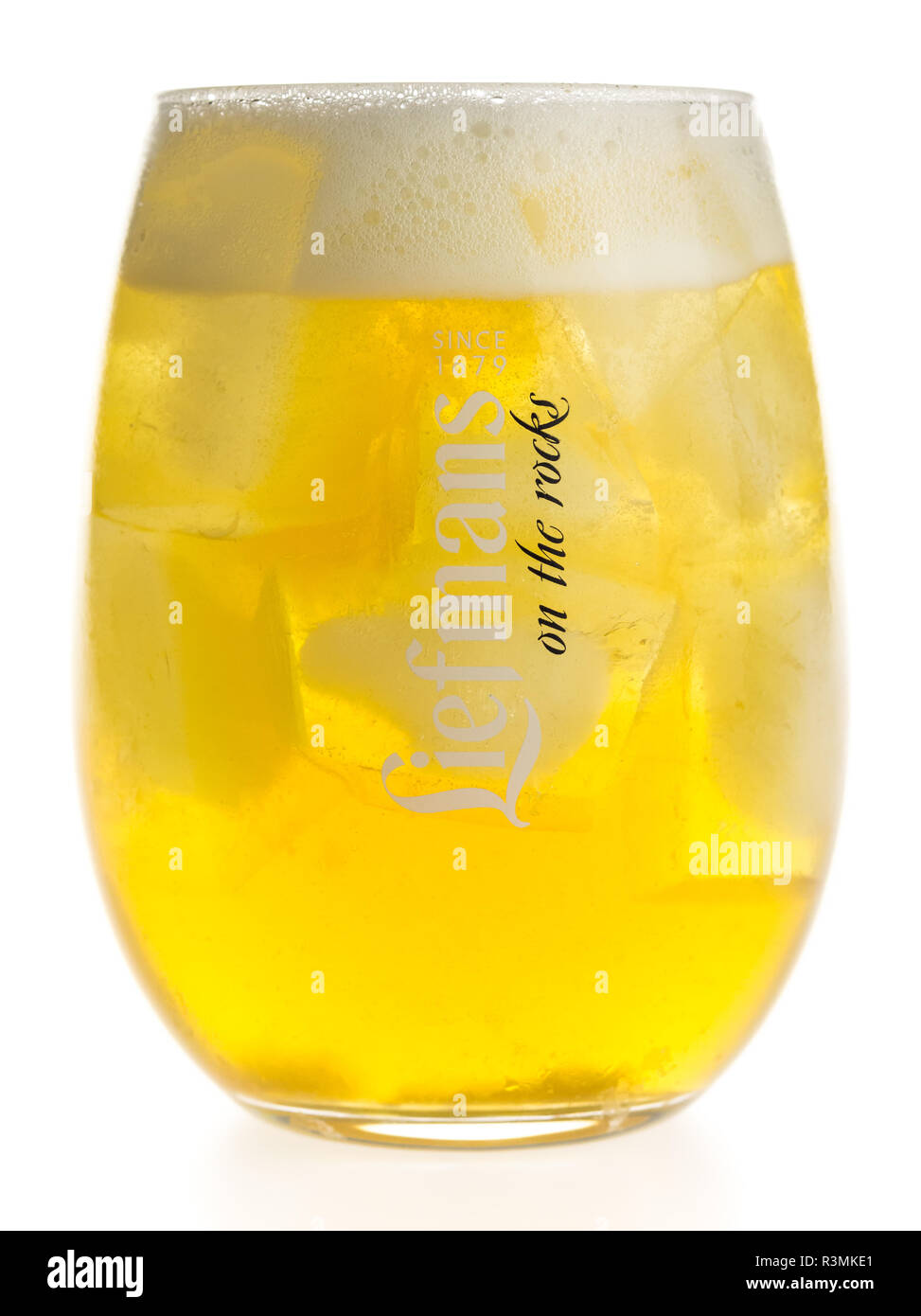 Glass of Belgian Liefmans Yelloh fruit beer isolated on a white ...
