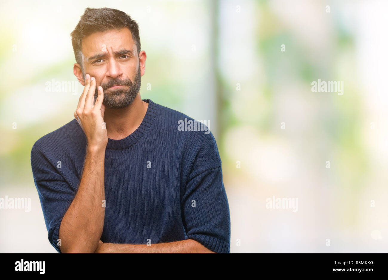 Adult hispanic man over isolated background thinking looking tired and ...