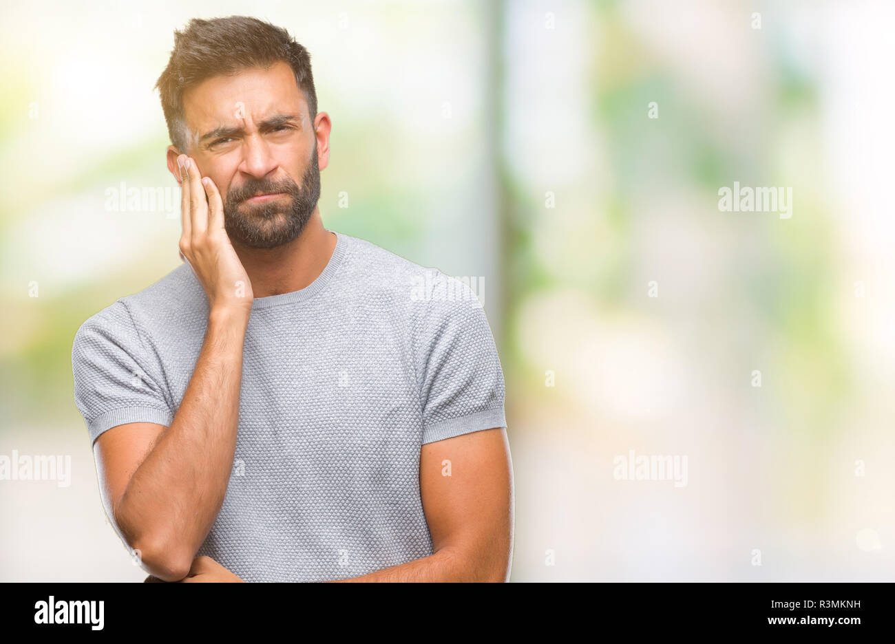 Adult hispanic man over isolated background thinking looking tired and ...
