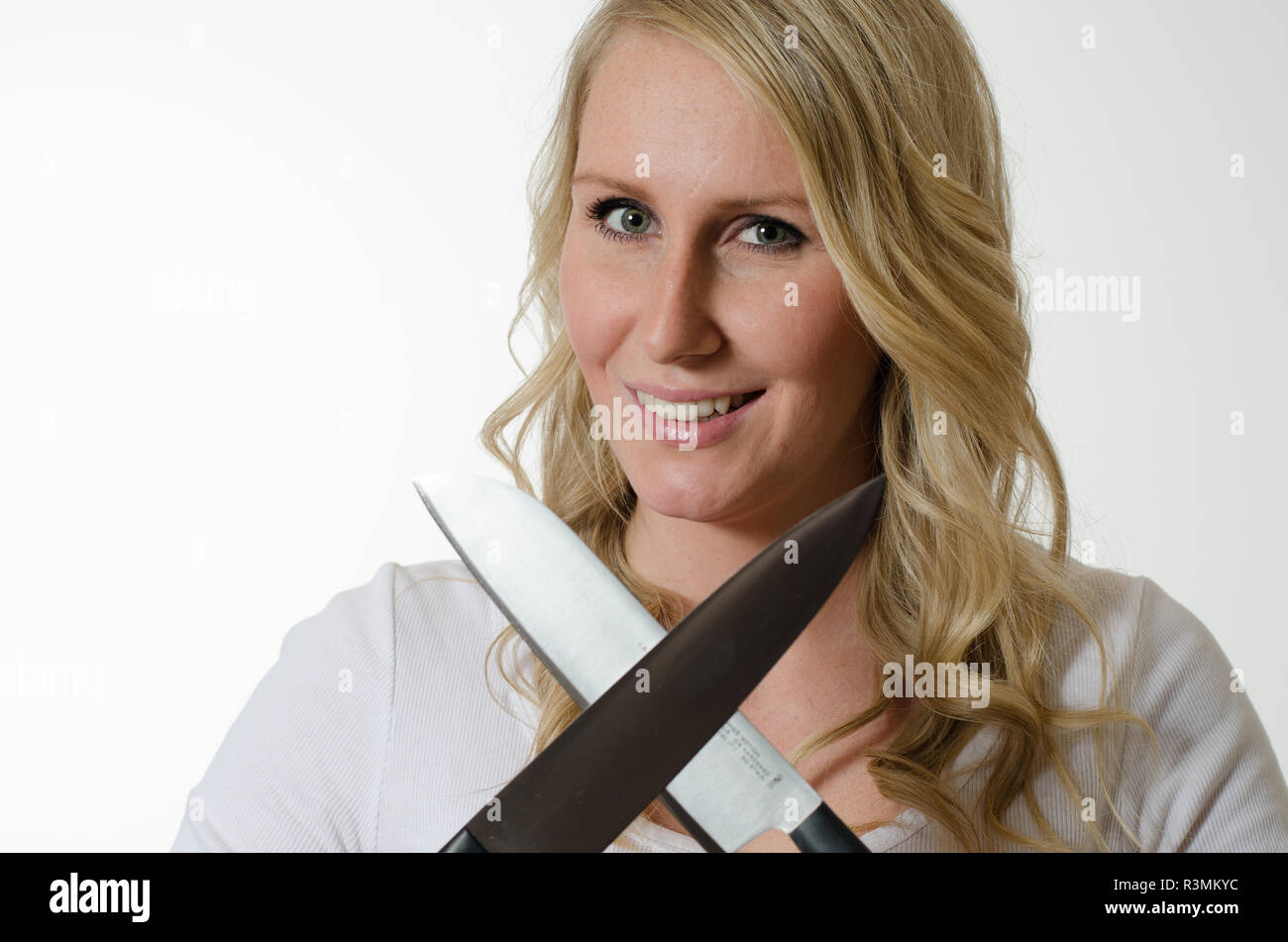 woman sharpening large knife Stock Photo - Alamy