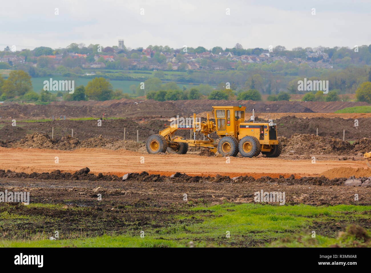 A Caterpillar motor grader used for levelling off road surfaces and ...
