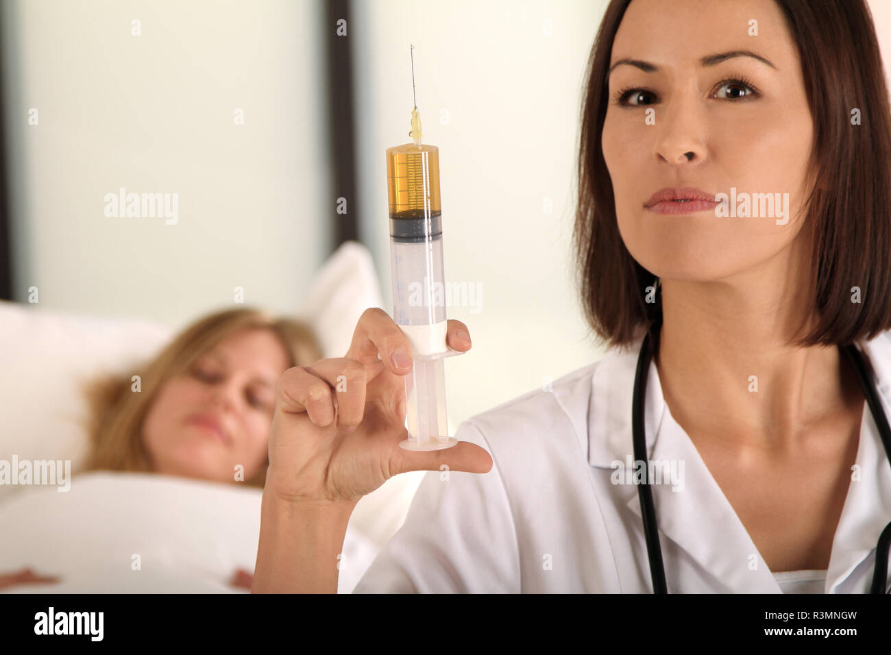 female doctor giving patient a syringe Stock Photo - Alamy